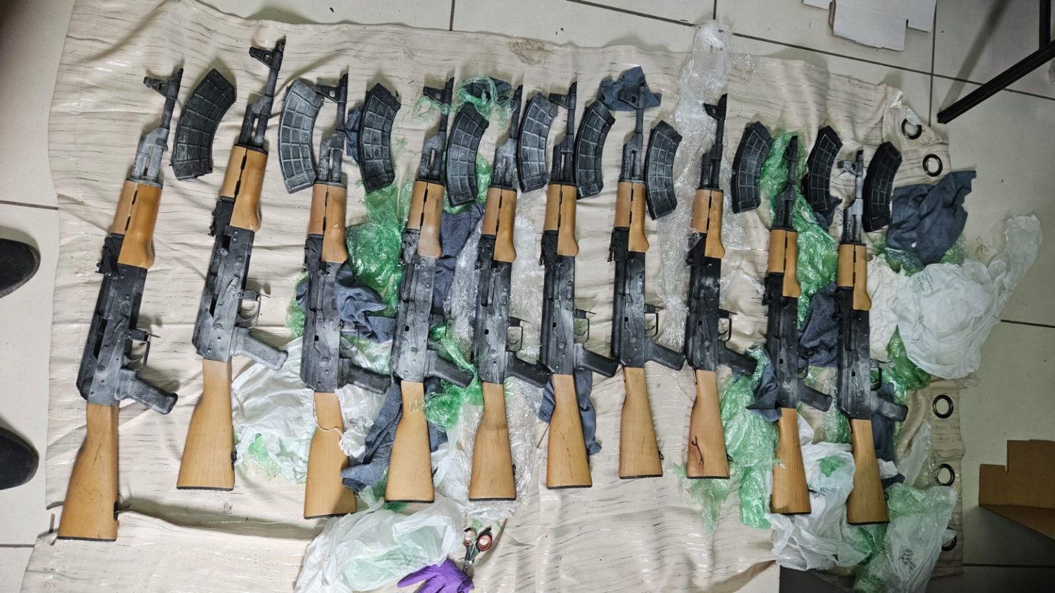 Ten AK-47 assault rifles found on Corentyne public road, one arrested ...